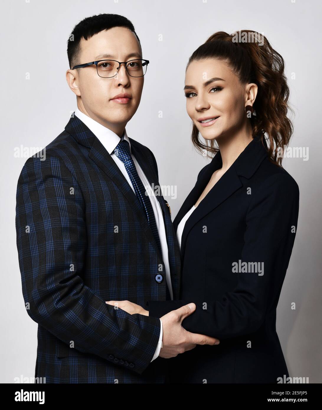 Young couple man and woman in love office workers partners coworkers in ...