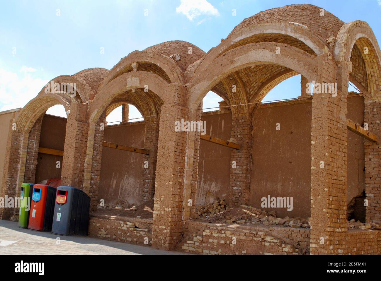 Three colored recycling wheelie bins for sorting waste on street. Yazd ...