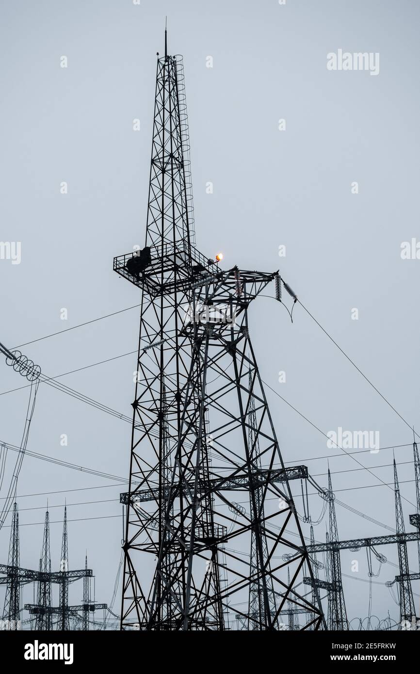 High-voltage power lines. Vertical photo. Transmission of electricity ...