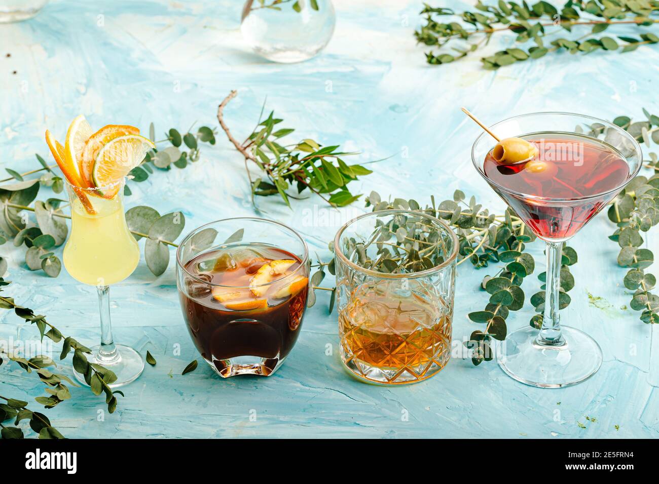 Assorted variety of different cocktails on blue Stock Photo - Alamy
