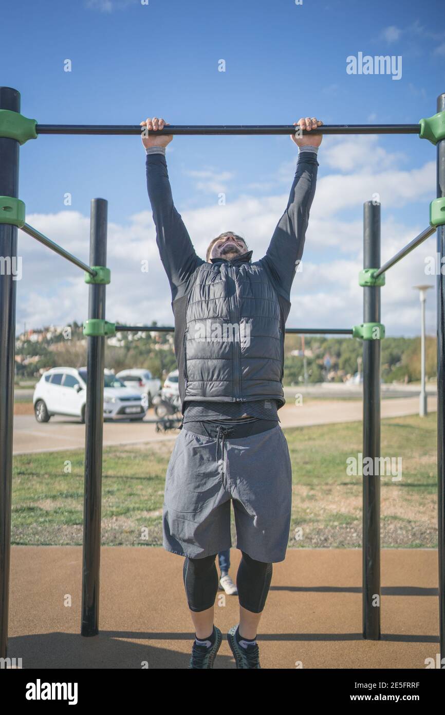 athletic man doing calisthenics in an outdoor park Stock Photo - Alamy