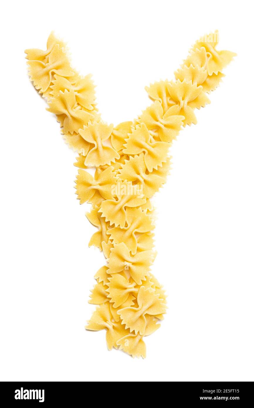 Letter Y of the English alphabet from dry farfalle pasta on a white ...