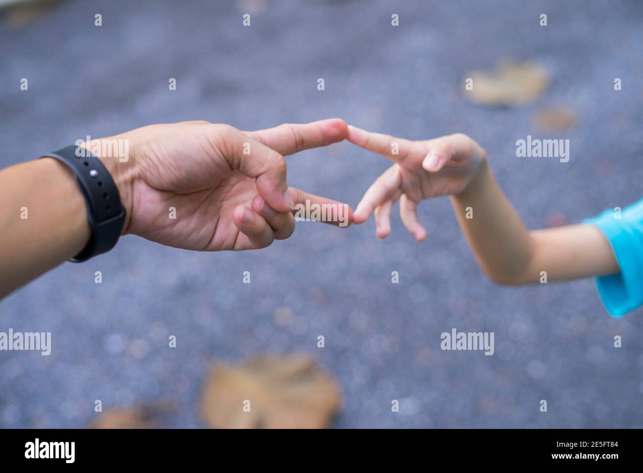 Little child and father bumping fists, man and child giving knuckle ...