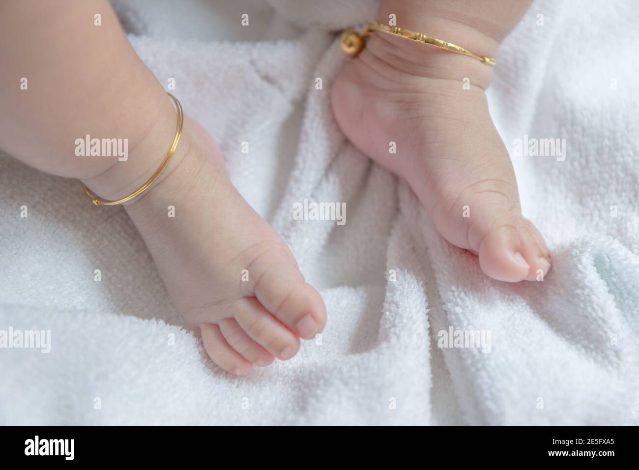 Two babys feet hi-res stock photography and images - Alamy