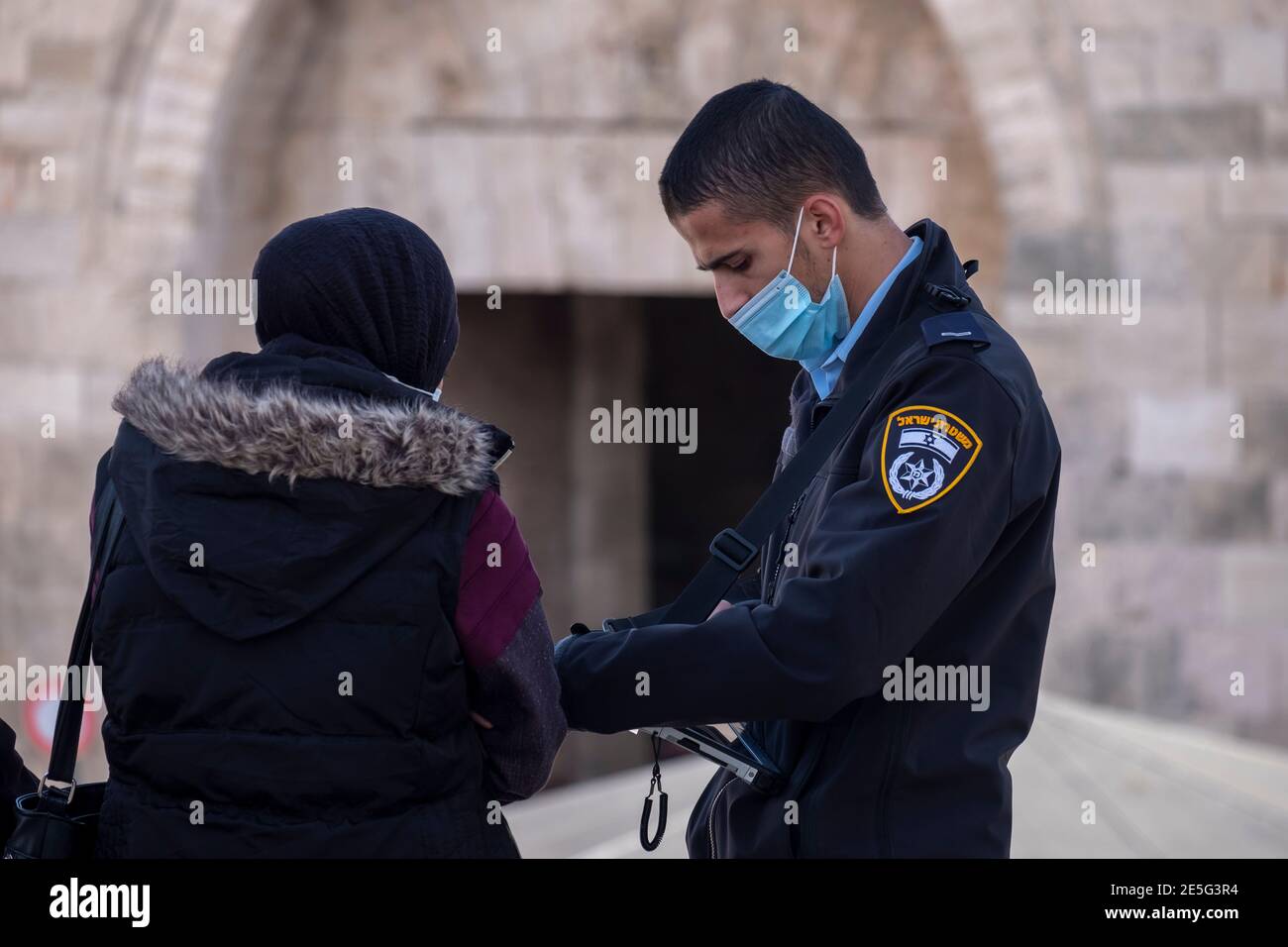 An Israeli policeman wearing face mask due to Covid-19 pandemic checks ...