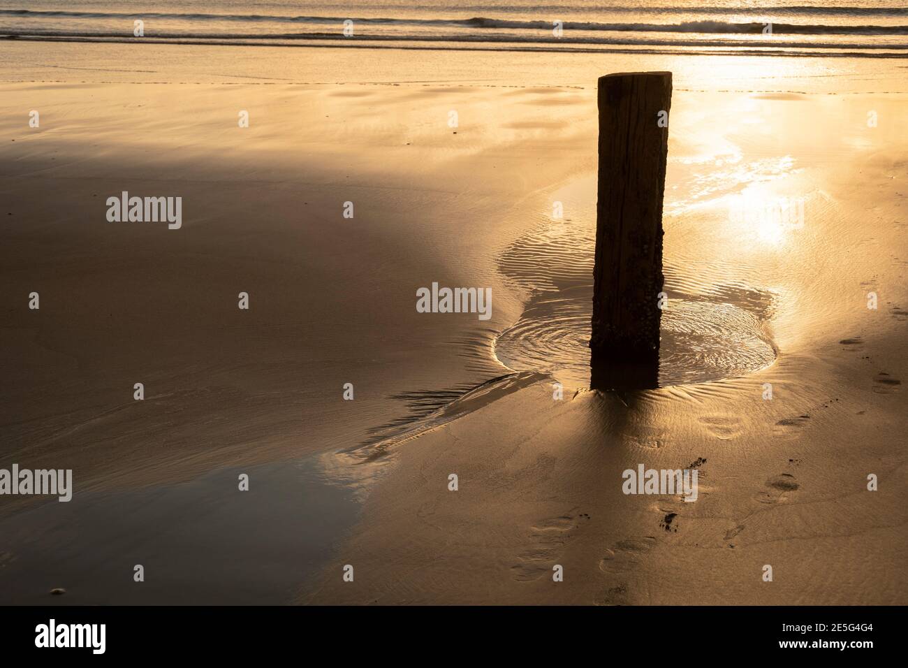 Remains of old wharf on beach at Akitio, Tararua District, North Island ...