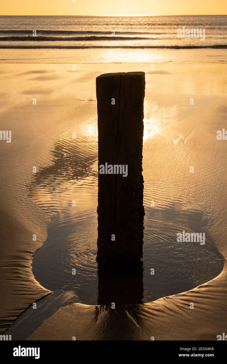 Remains of old wharf on beach at Akitio, Tararua District, North Island ...