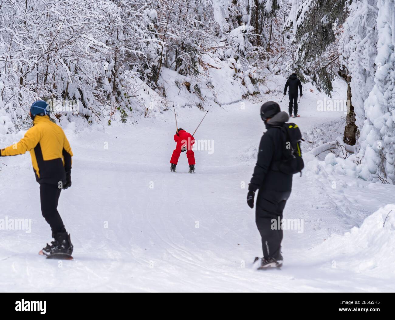 People enjoying skiing and snowboarding on the Clabucet ski lope in ...