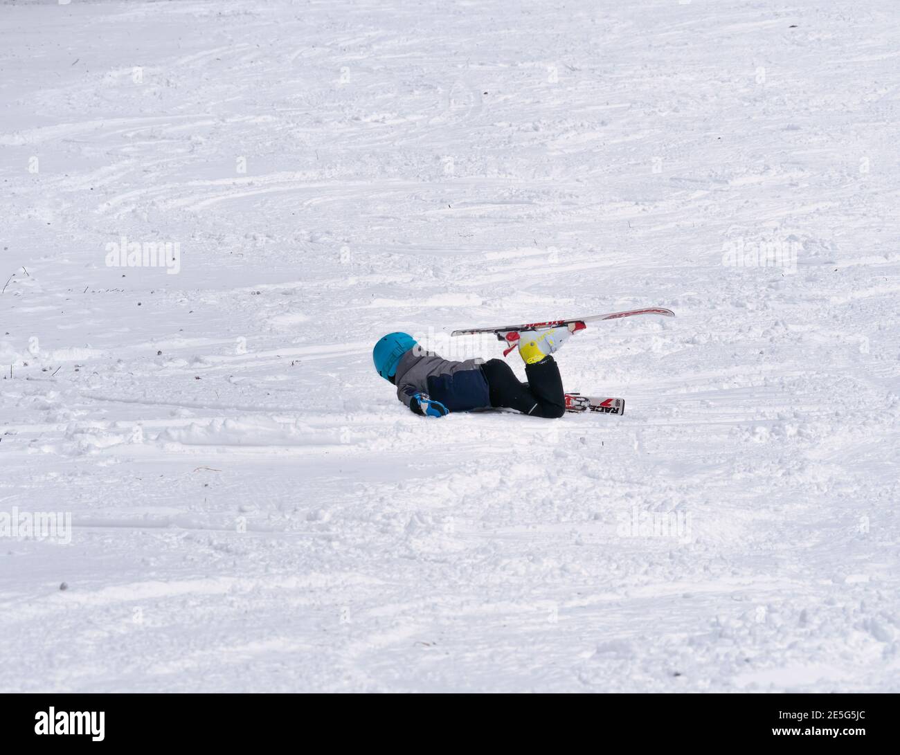 Young skier falling down ski hi-res stock photography and images - Alamy