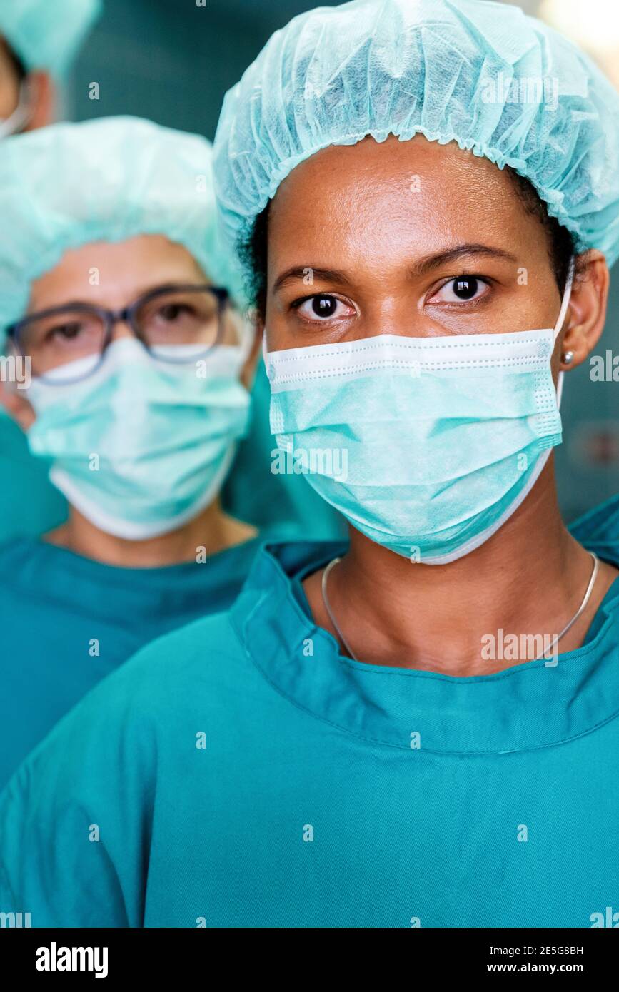 Successful team of surgeon standing in operating room, ready to work on ...