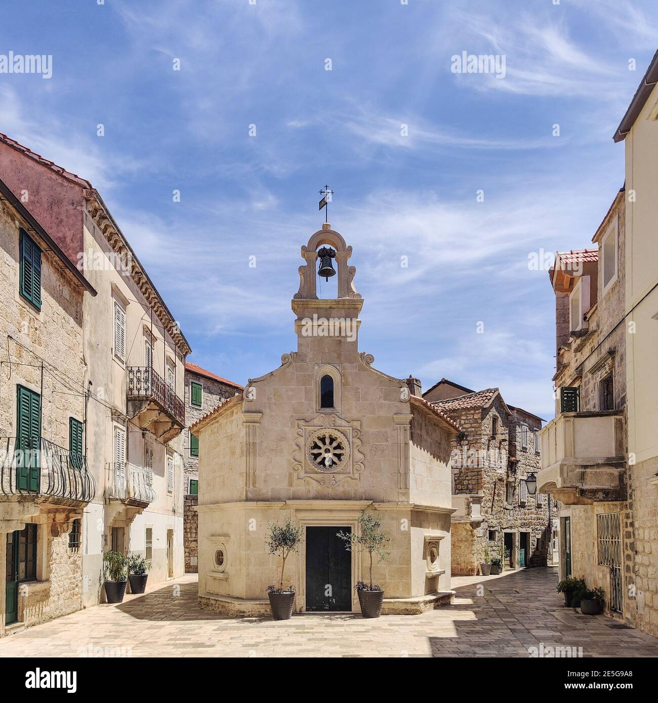 Small church on square of small urban village of Stari grad on Hvar ...