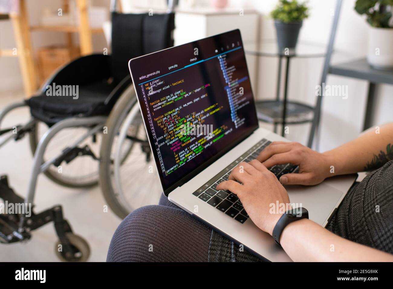 Hands of young contemporary disable female programmer touching keys of ...
