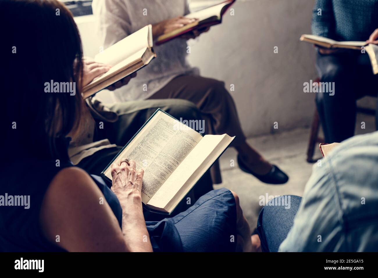 Group christianity people reading bible together Stock Photo - Alamy