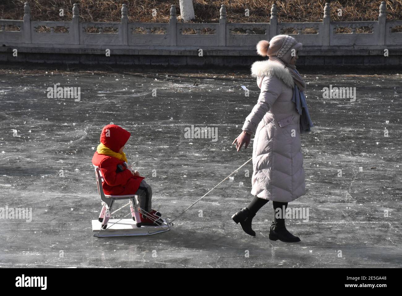 Citizens skate in the Kunyu river ice area in the snow and the ice is ...