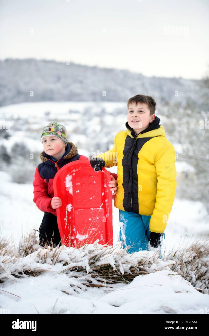 Two boys sledging hi-res stock photography and images - Alamy