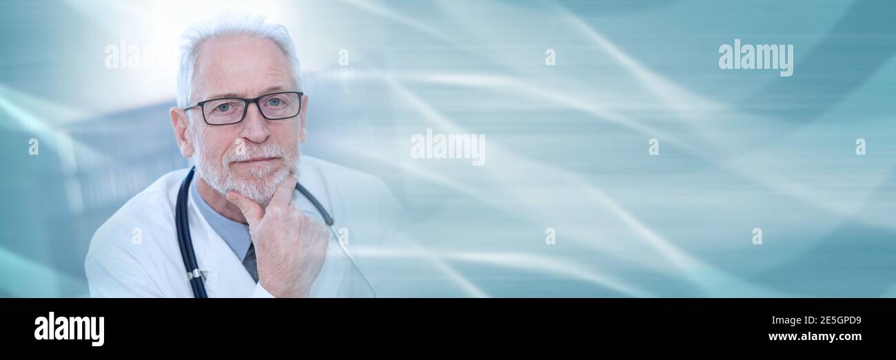 Portrait of male senior doctor looking the camera; panoramic banner ...