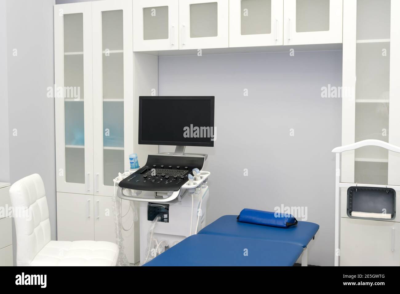 Interior of examination room with ultrasonography machine in hospital ...