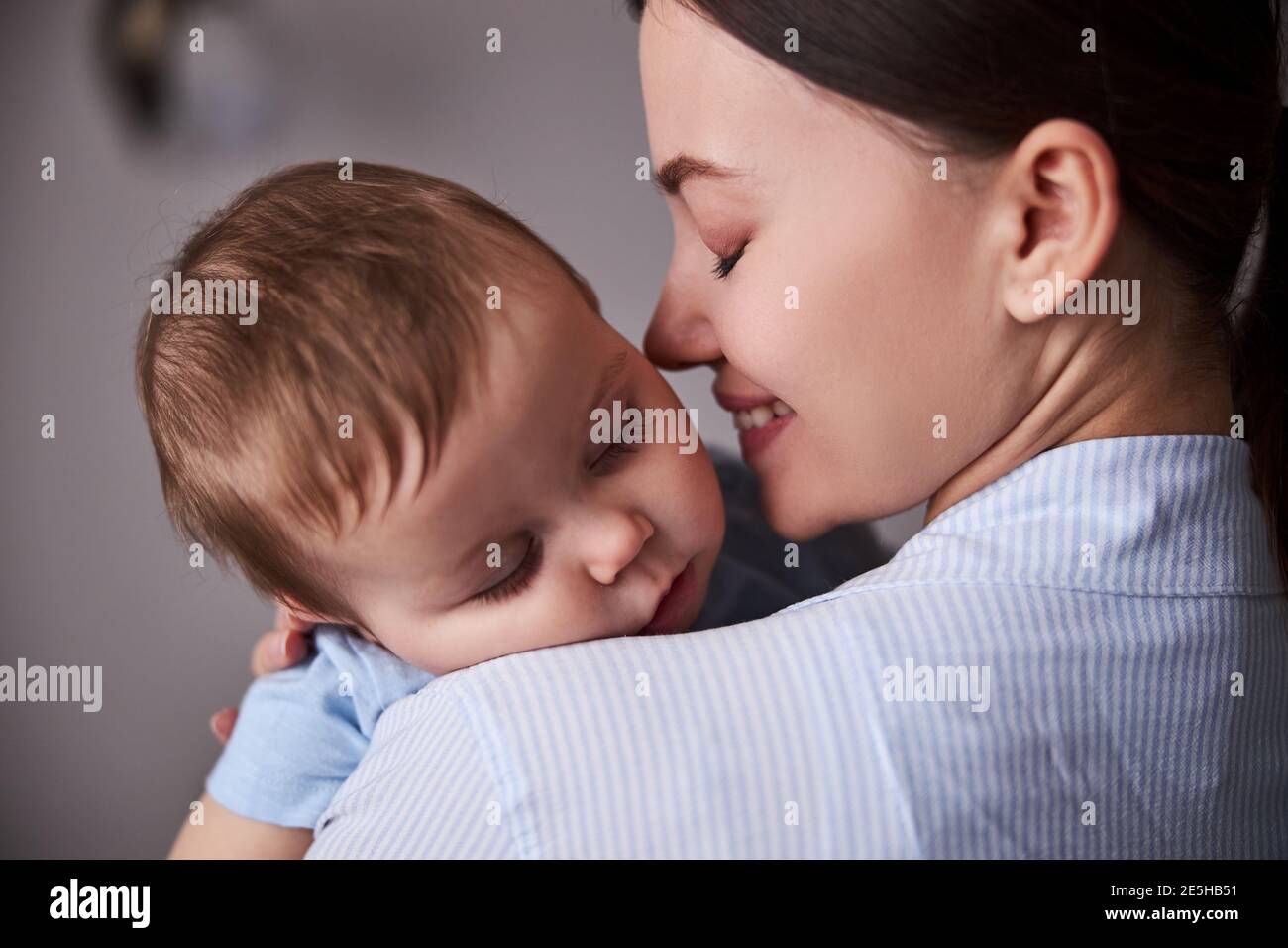 Close up of happy female smelling her baby Stock Photo - Alamy