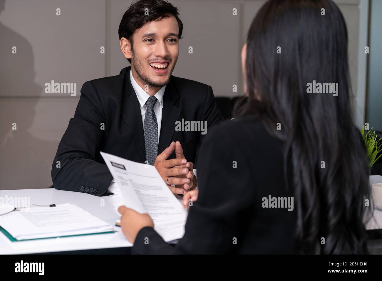 Human resource manager interviewing the male employment candidate in ...