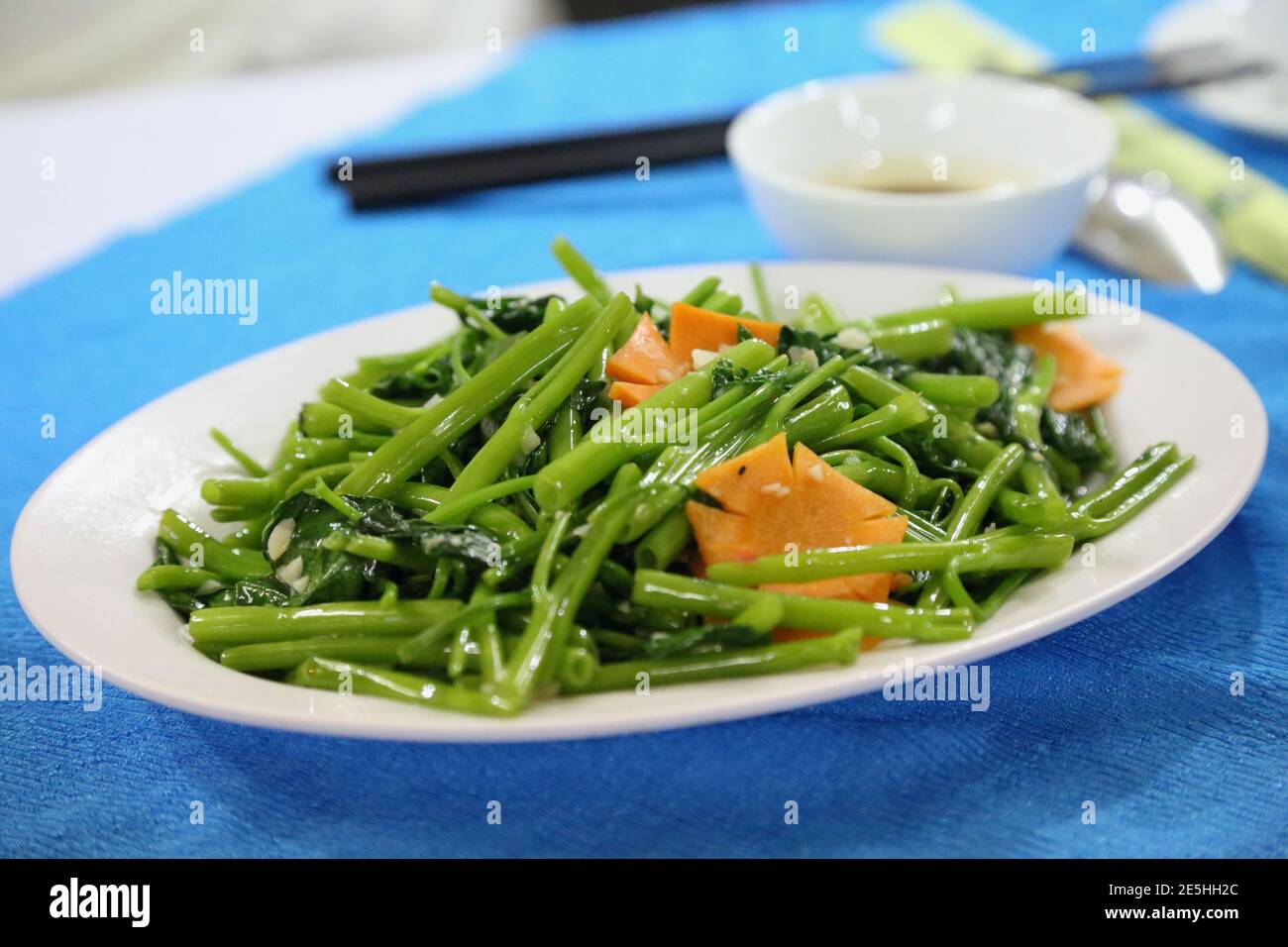 Stir-fried Vietnamese morning glory vegetable Stock Photo - Alamy