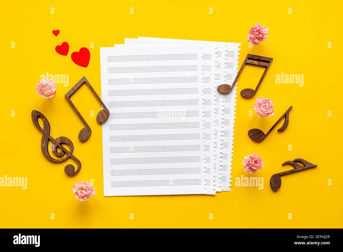 Musical wooden notes on music sheet. Top view Stock Photo - Alamy