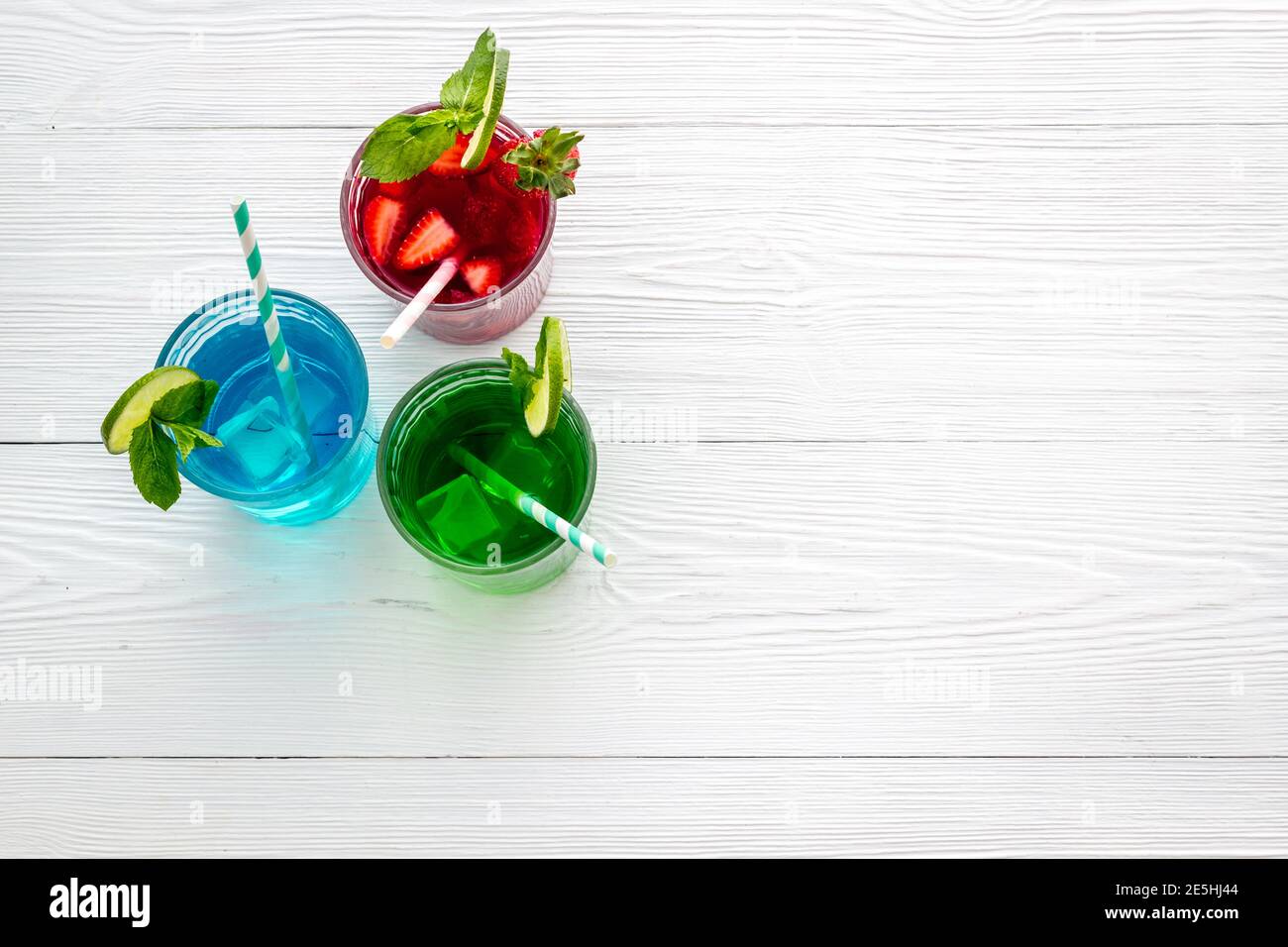 Cold green, blue and red cocktails with fresh fruits and mint Stock ...