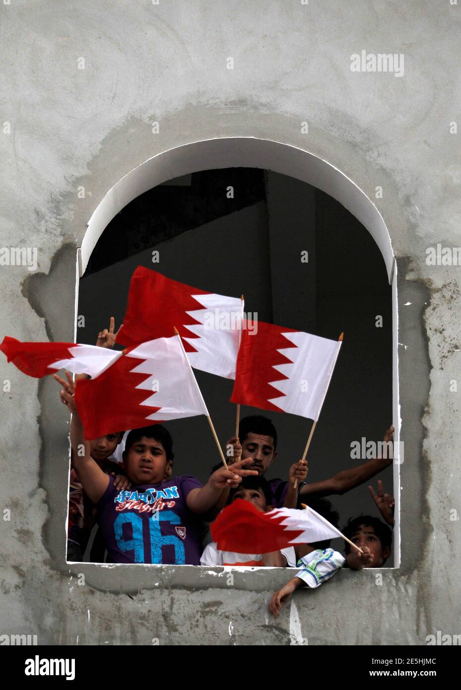 Bahrain flag in hand hi-res stock photography and images - Alamy