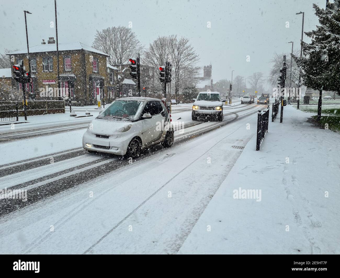 A rare snowfall in London making difficult driving conditions Stock ...
