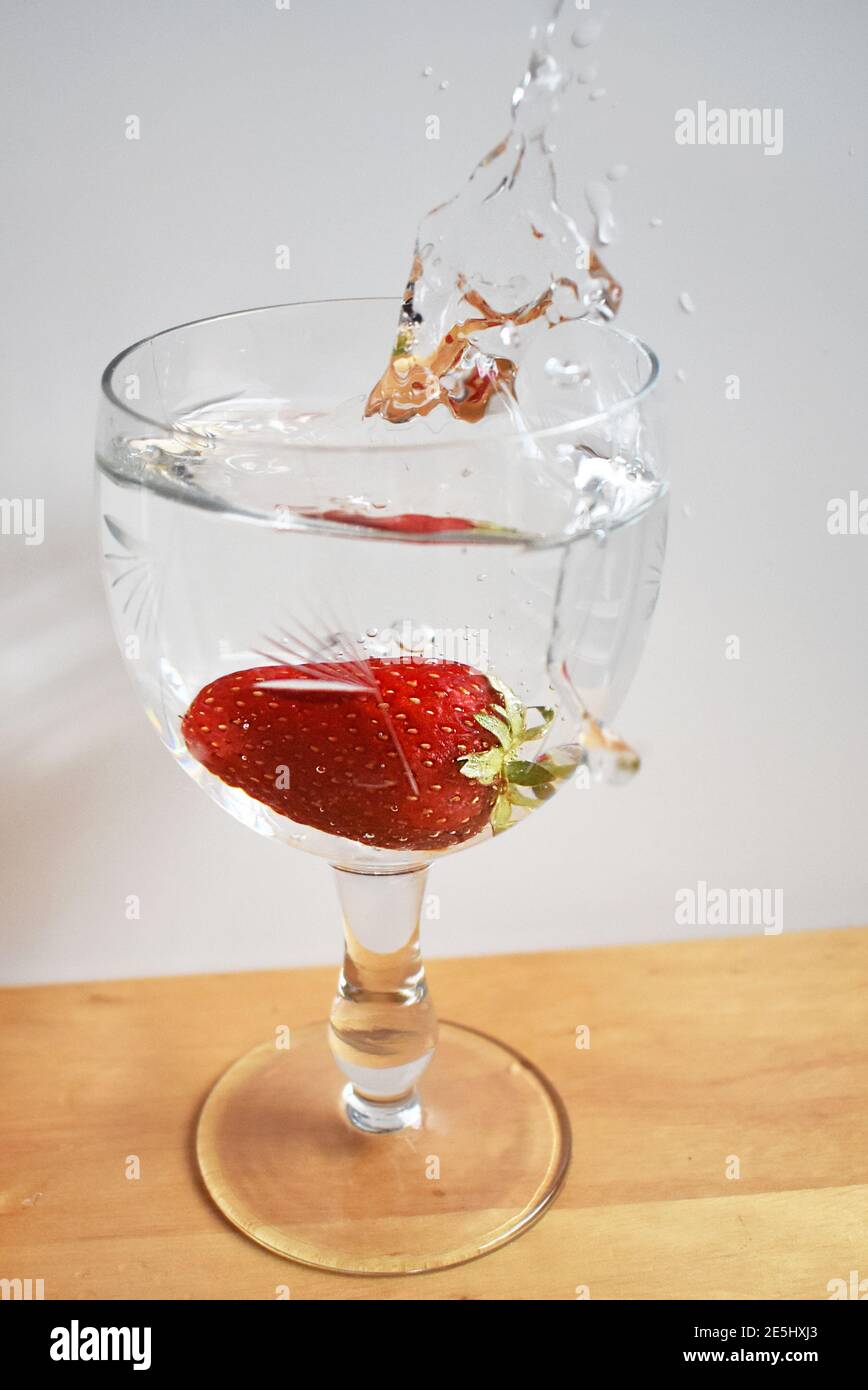 Berry in glass with water Stock Photo - Alamy