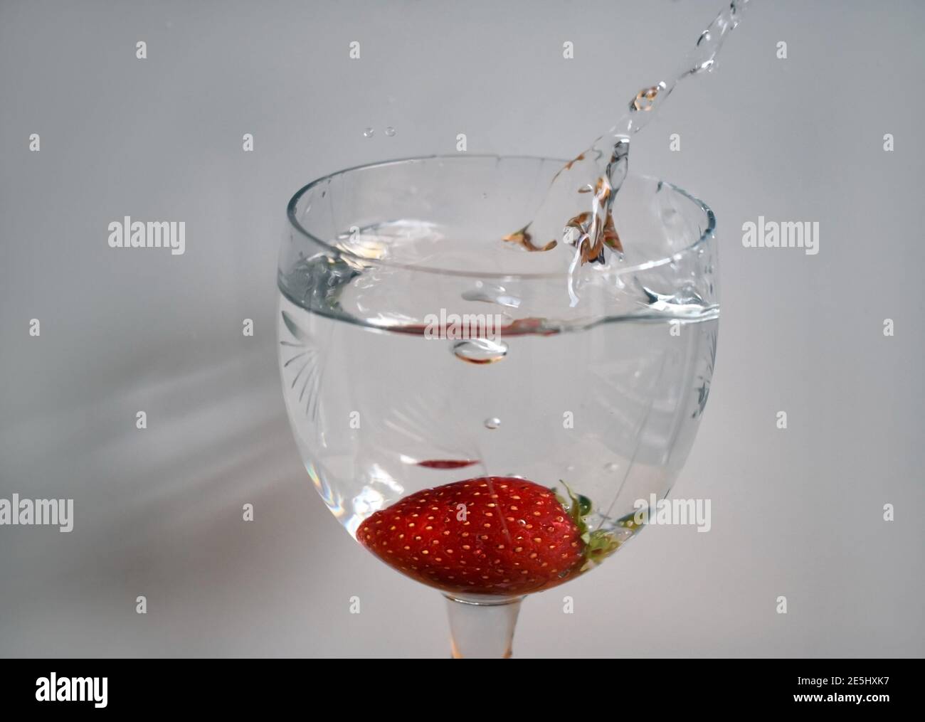 Berry in glass with water Stock Photo - Alamy