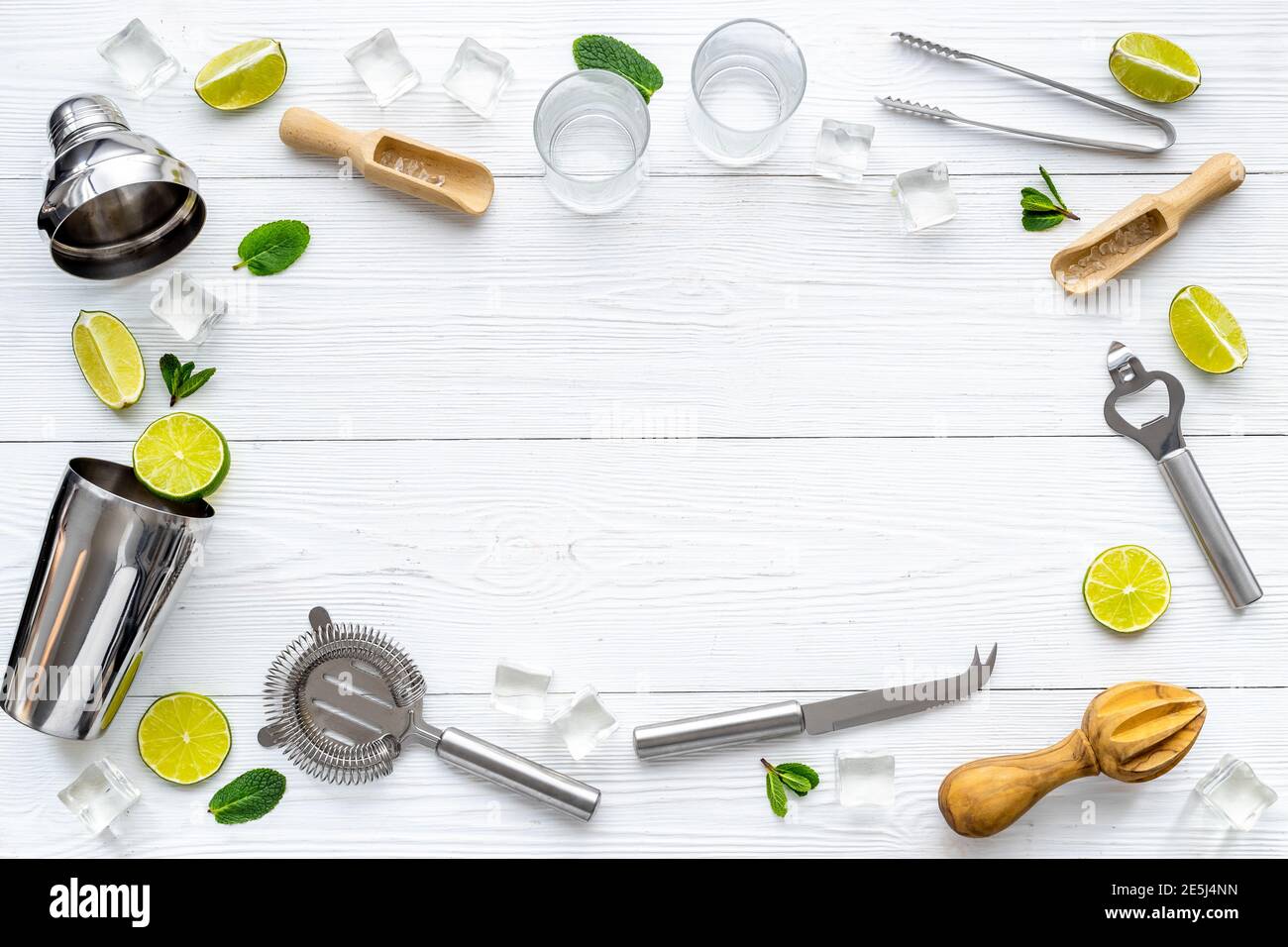 Frame of bar equipment and cocktail ingredietns - shaker, lime and ice ...