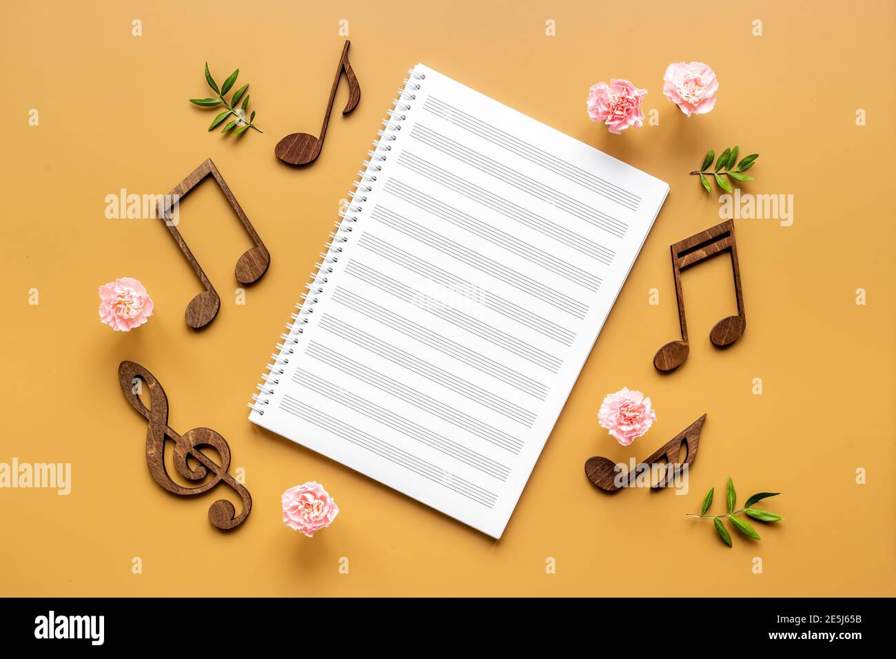 Musical wooden notes on music sheet. Top view Stock Photo - Alamy