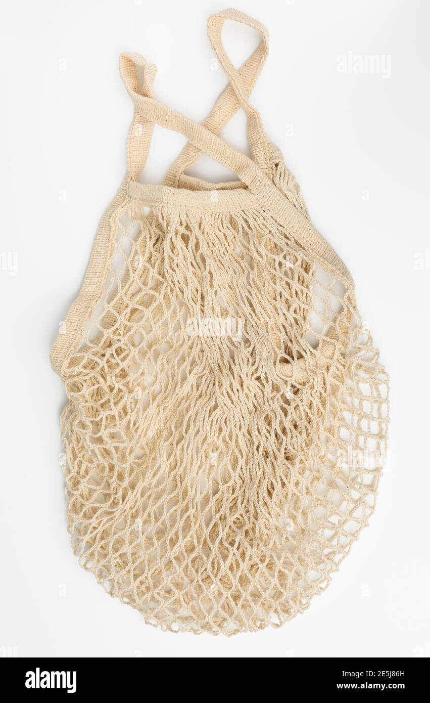 white reusable string bag woven from thread on white background, zero ...