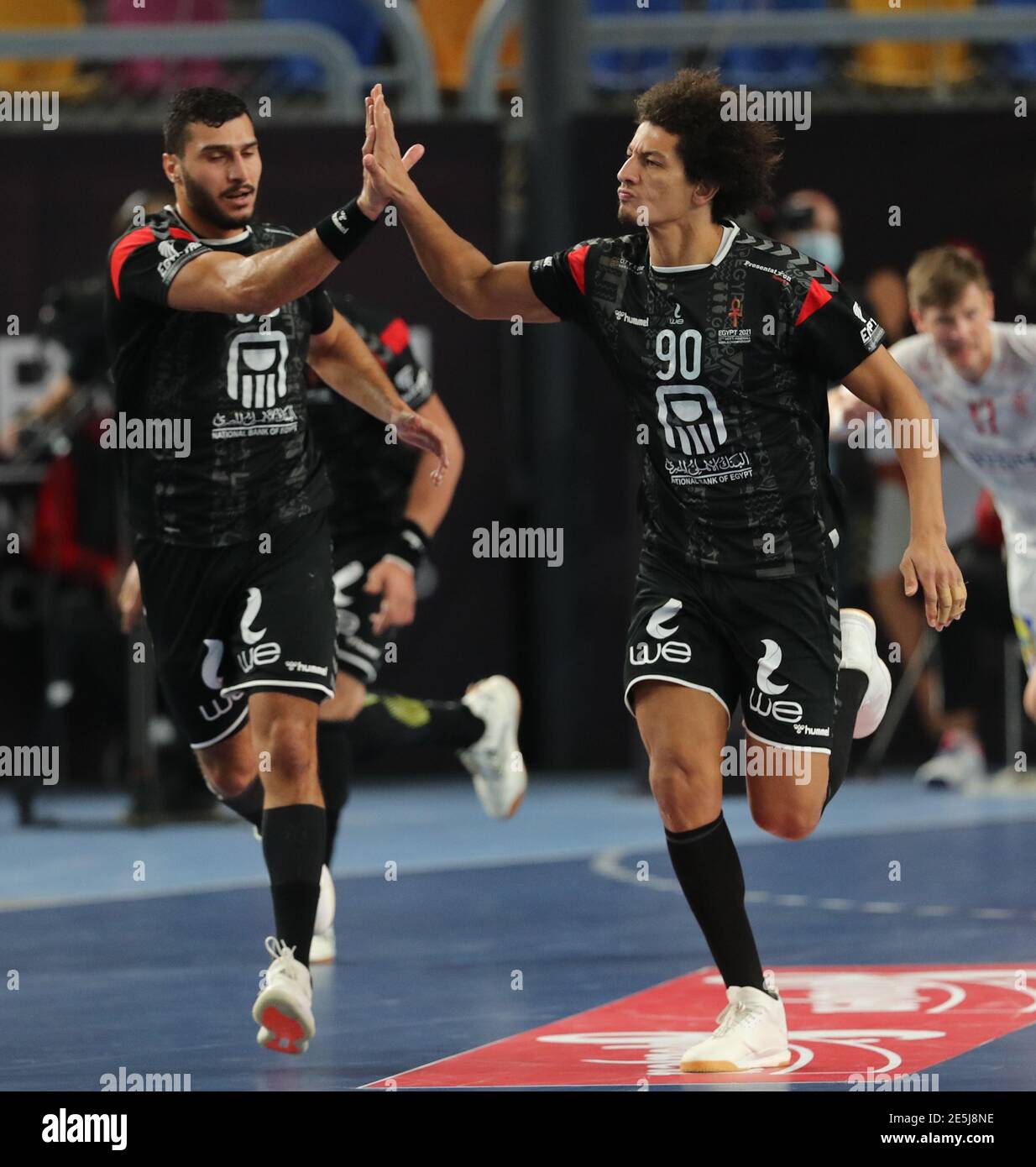 Cairo, Egypt. 27th Jan, 2021. Ali Zein (R) of Egypt celebrates with his ...