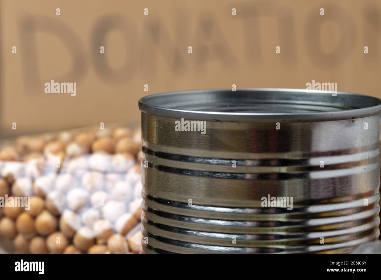 Donations food with canned food on the table background. Donate concept ...