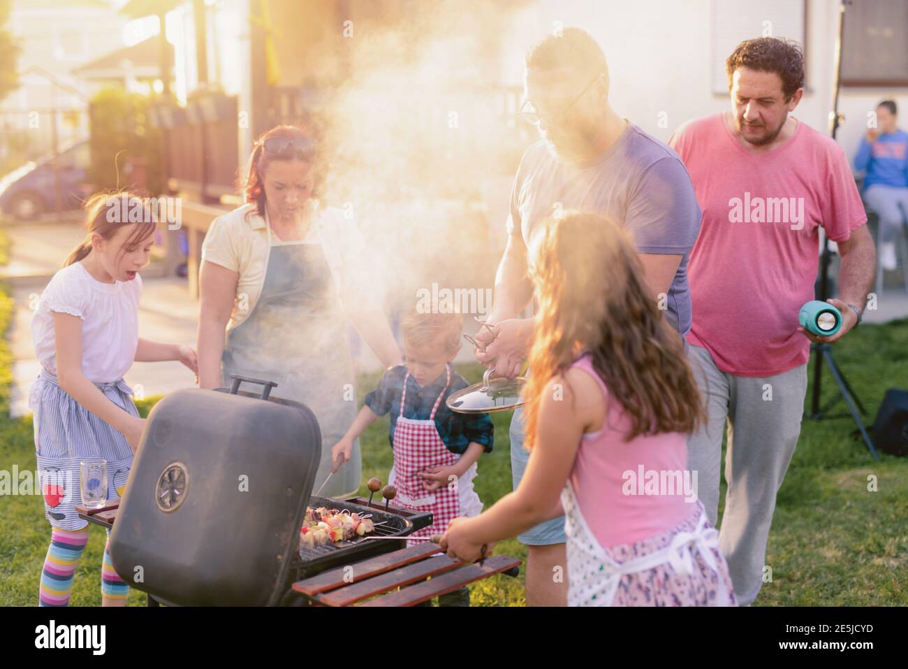 Picture of big happy family making barbeque in their backyard. Family ...