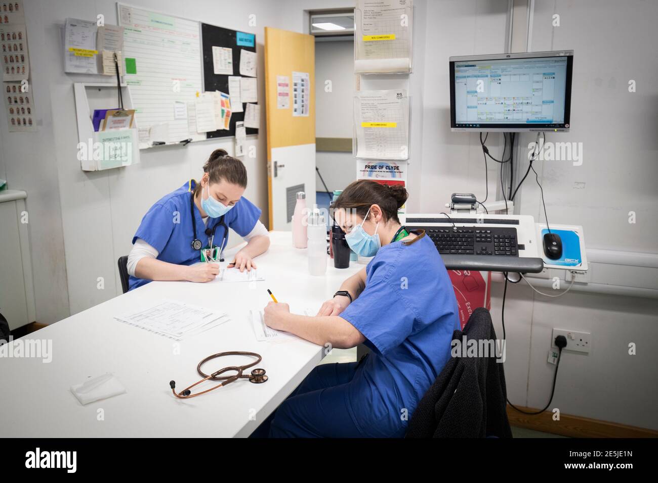 Doctors write up their patient notes in the clinical hub of the ...