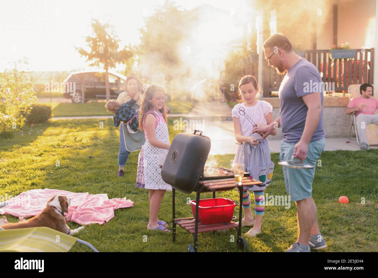 Picture of big happy family making barbeque in their backyard. Family ...