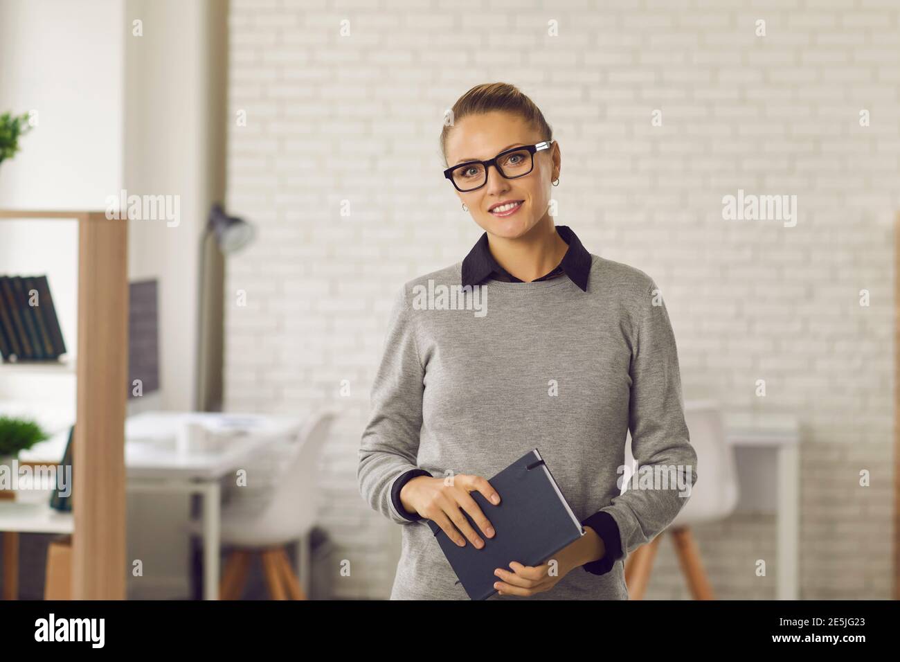 School secretary smiling hi-res stock photography and images - Alamy