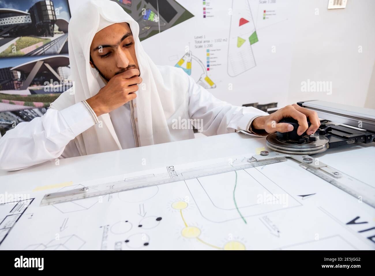 Arab architect preparing his desk and thinking about new ideas Stock ...