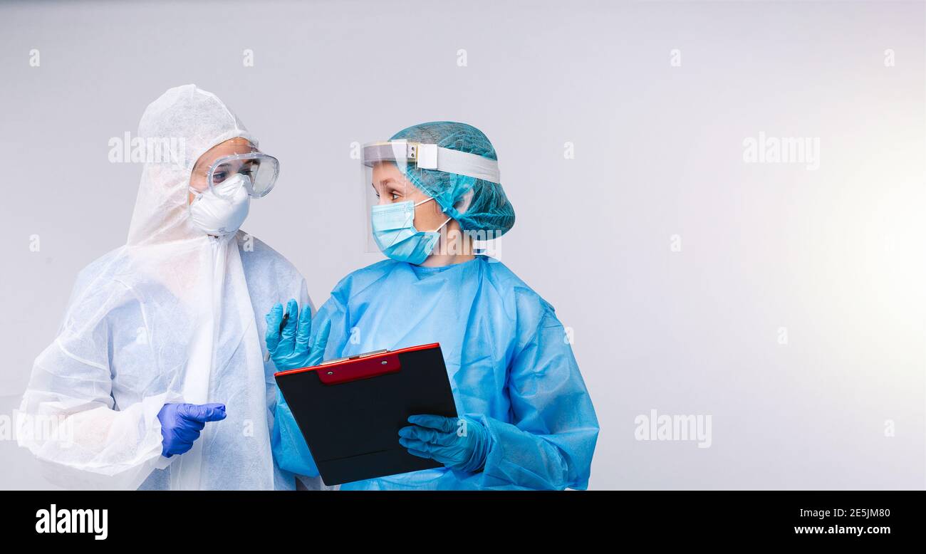 Banner,long format. Two doctors in medical gear and a list of incoming ...