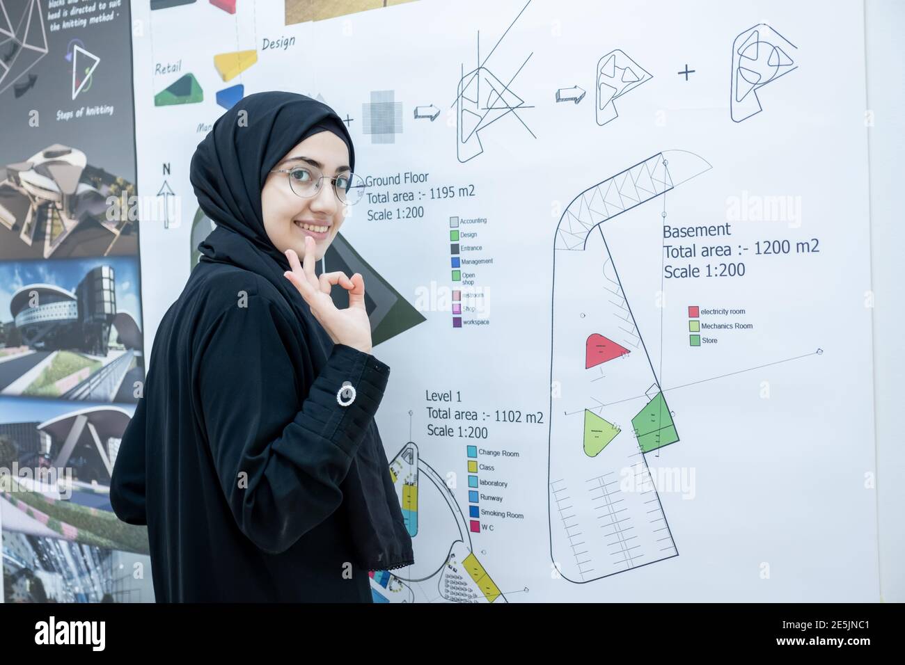 Arab female architect finishing and showing her project Stock Photo - Alamy