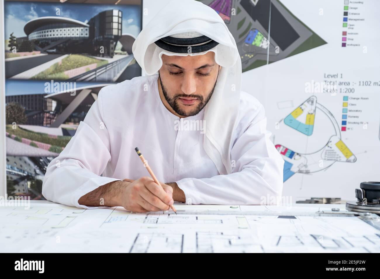 Focused arab architect working on a new project Stock Photo - Alamy