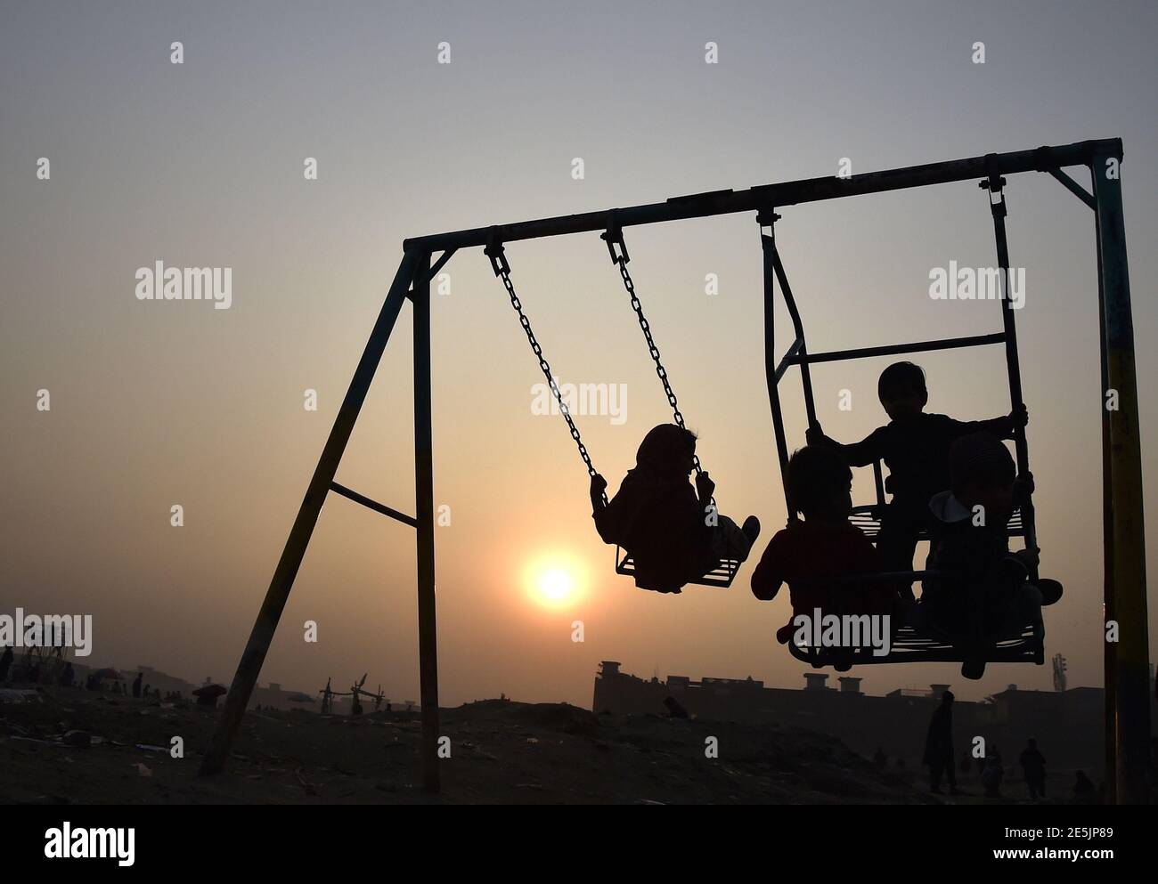 Children ride on swing in hi-res stock photography and images - Alamy