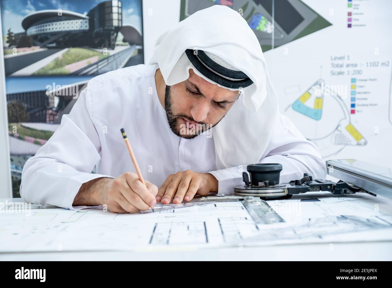 Focused arab architect working on a new project Stock Photo - Alamy