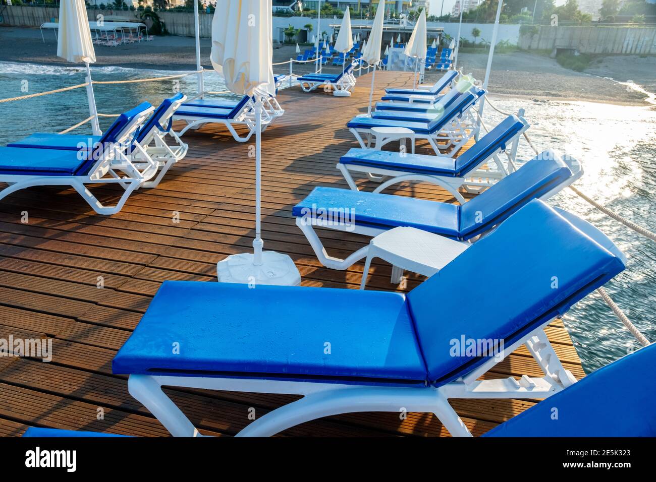 pier with benches on it ready for summer vacation on the white sea ...
