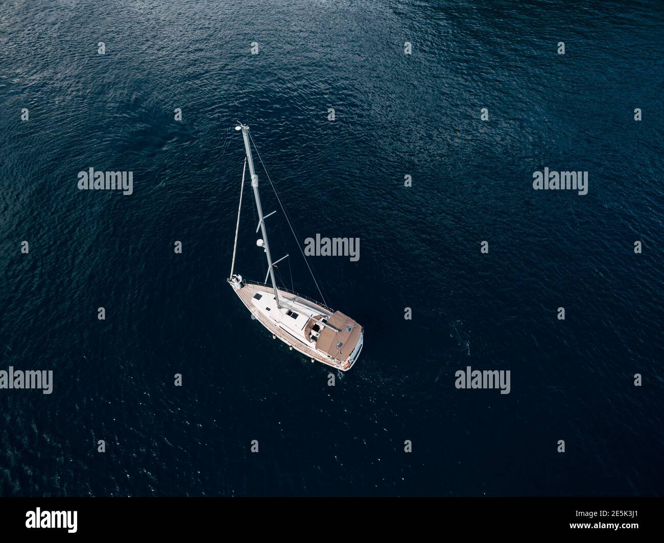 Top view of a sailing yacht sailing on the sea Stock Photo - Alamy