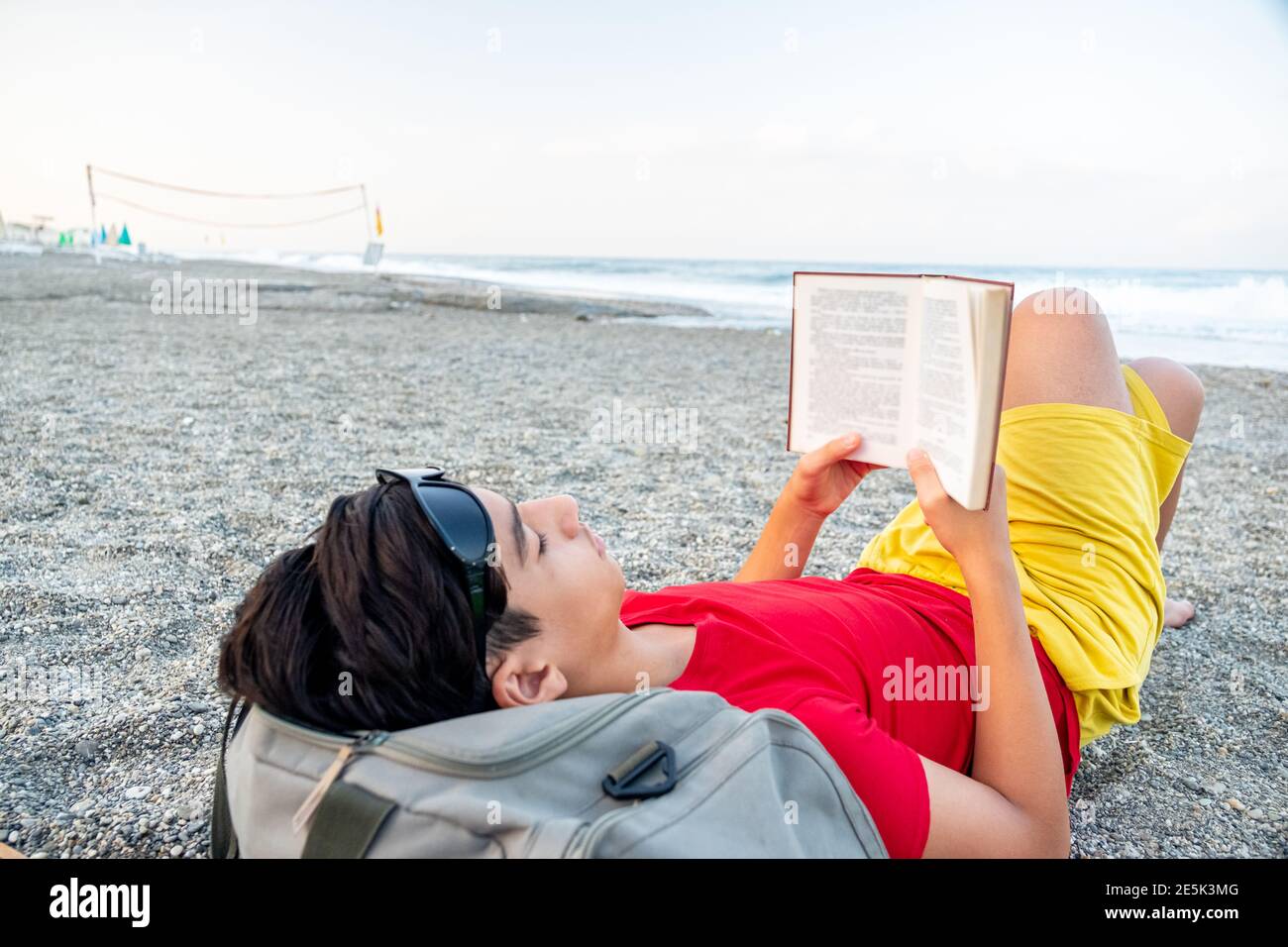 Man looking at his sun glasses on the sea hi-res stock photography and ...