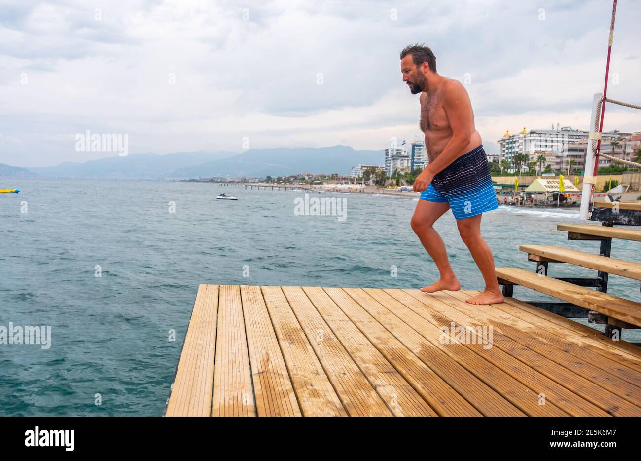 Man jumping inside the ocean Stock Photo - Alamy