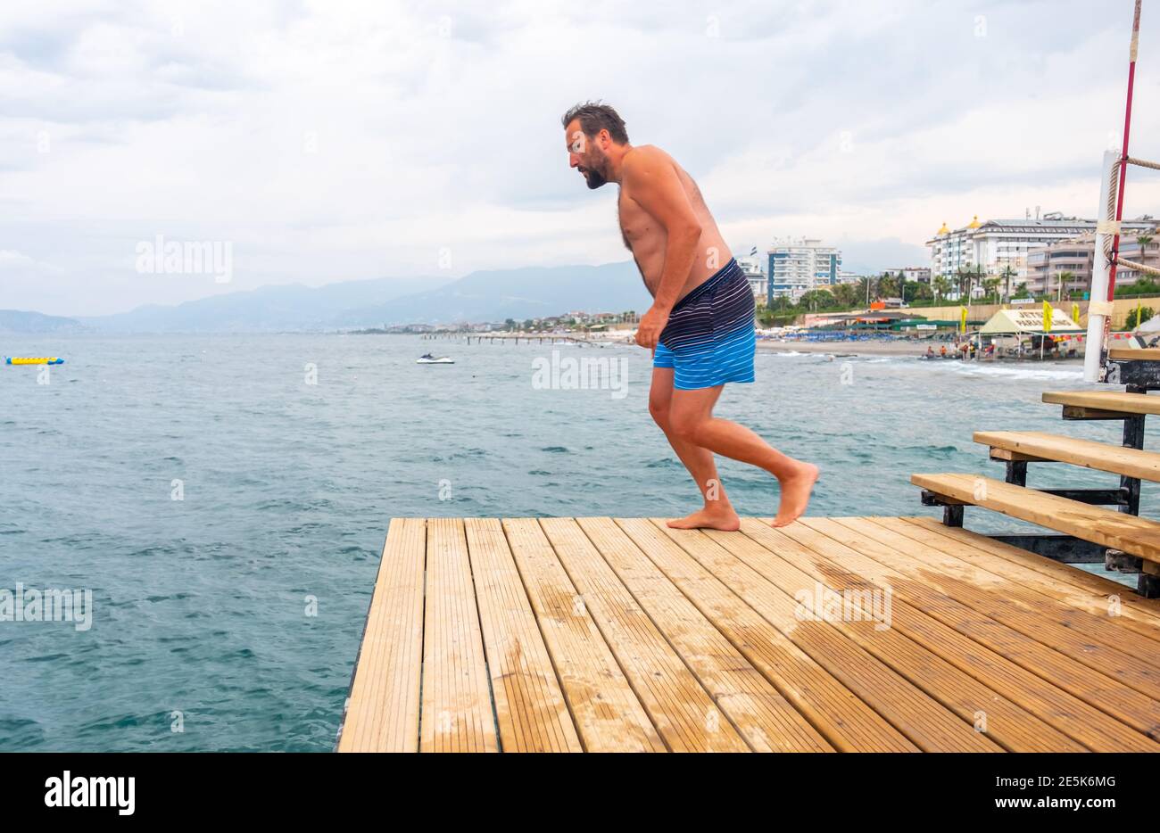 Man jumping inside the ocean Stock Photo - Alamy